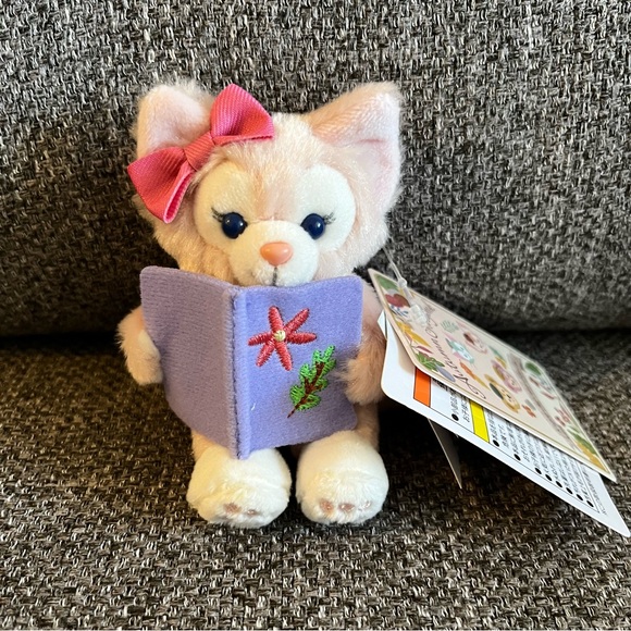 Disney | Toys | Bnwt Japan Tokyo Disneyland Plush Keychain Reading Book ...